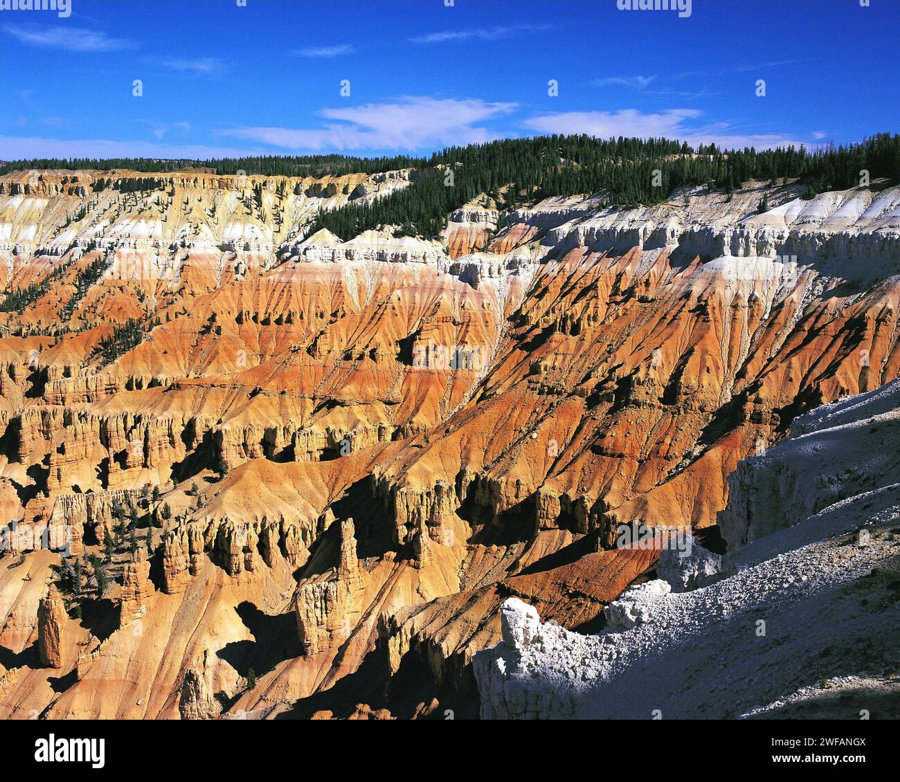 The slopes of Cedar Breaks canyon with eroded pinnacles and colorful ...