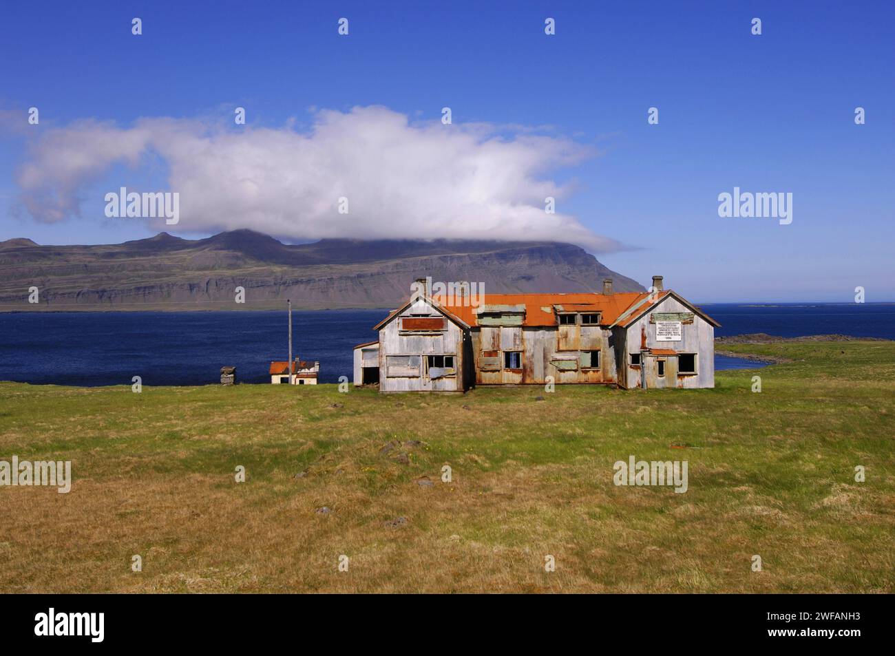 Old abandoned hospital building at the mouth of Faskrudfjordur in the ...