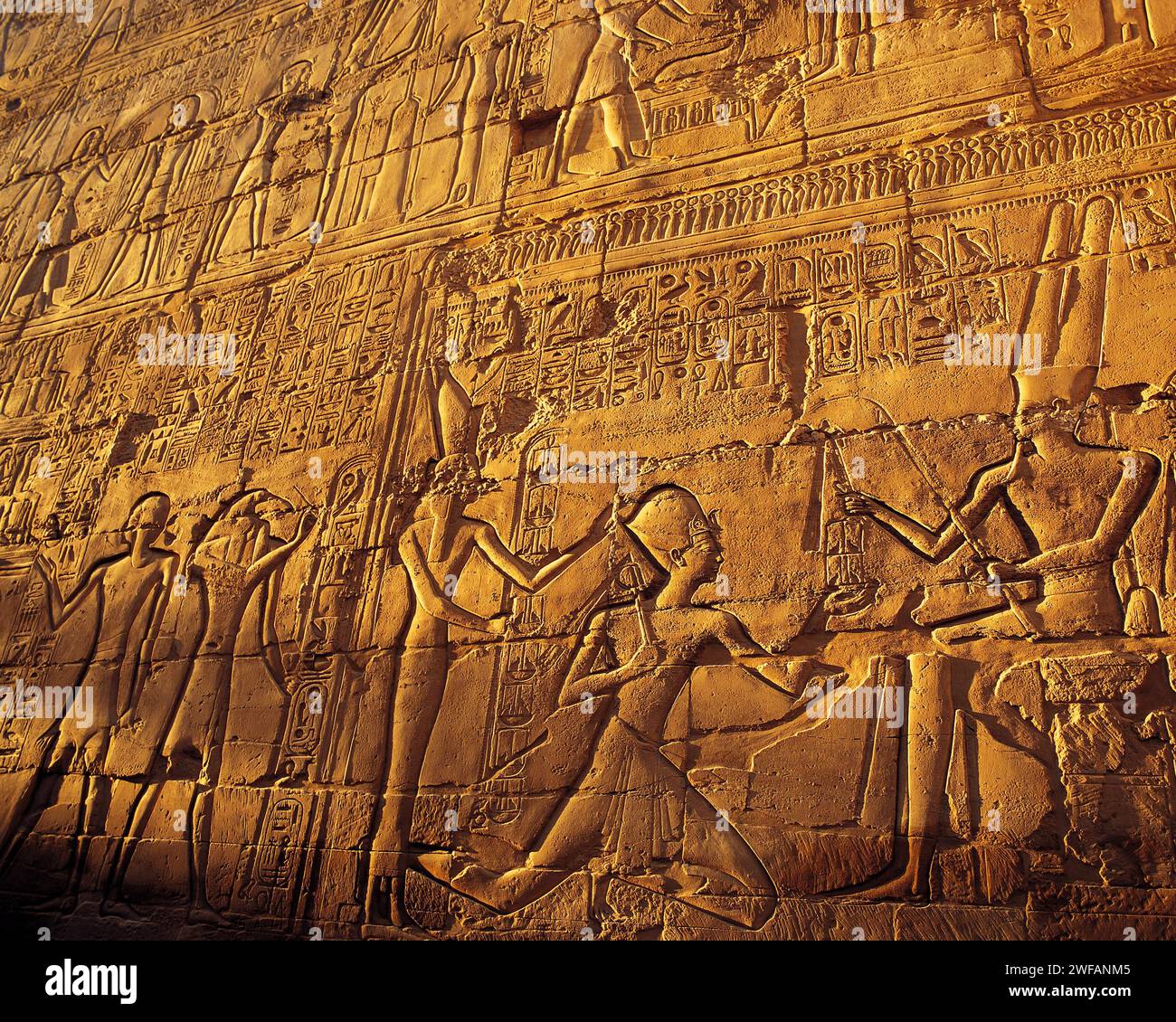 Elaborate carved stone relief with close-ups of pharonic figures in ...