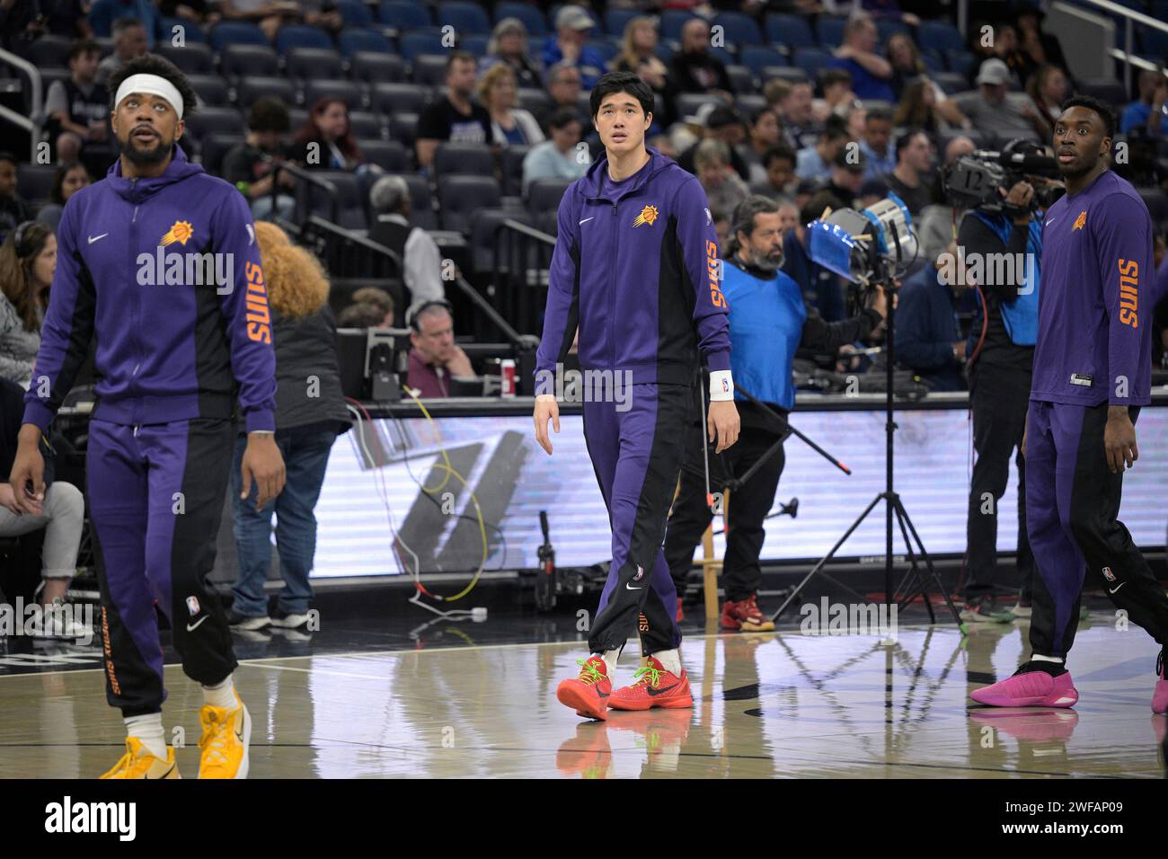 Phoenix Suns forward Yuta Watanabe, center, warms up before an NBA ...