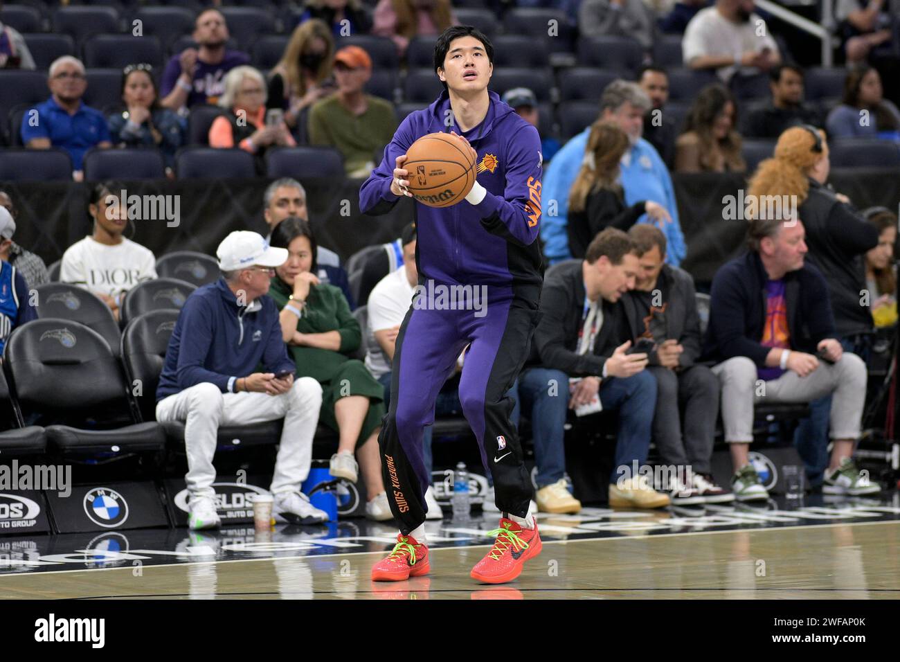 Phoenix Suns forward Yuta Watanabe warms up before an NBA basketball ...