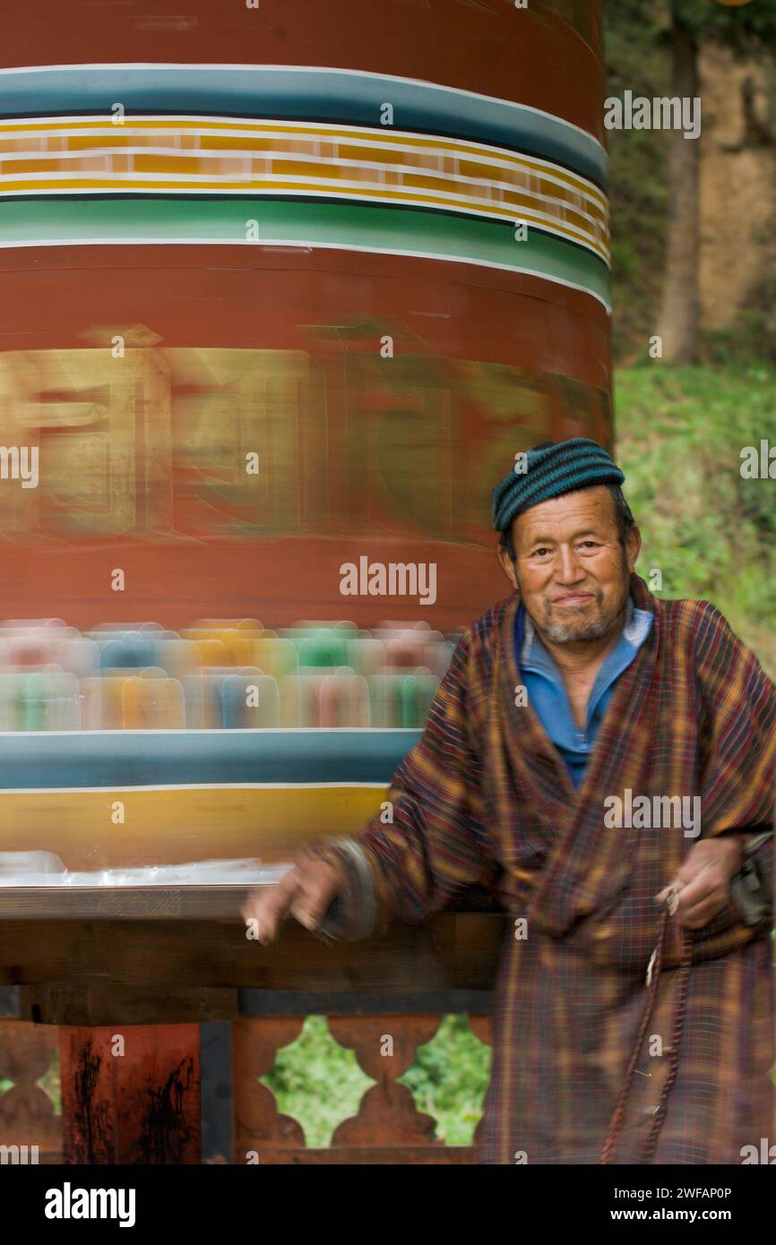Buddhist man prayer wheel hi-res stock photography and images - Alamy