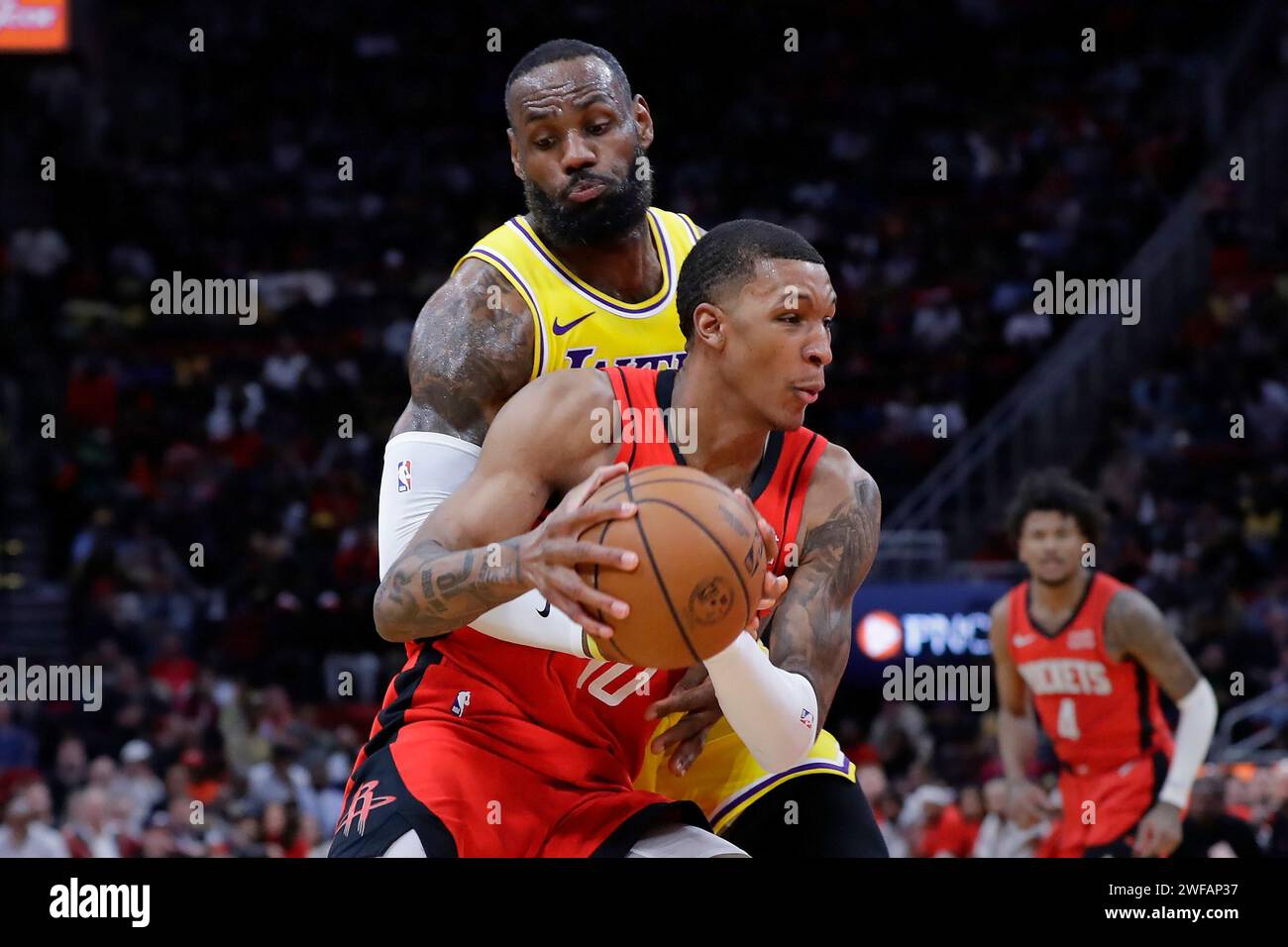 Los Angeles Lakers forward LeBron James, left, reaches around to knock ...