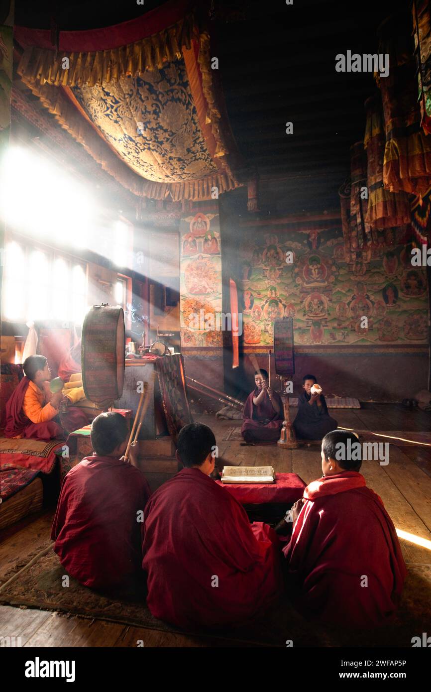 Young monks play musical instruments during a special blessing ceremony ...