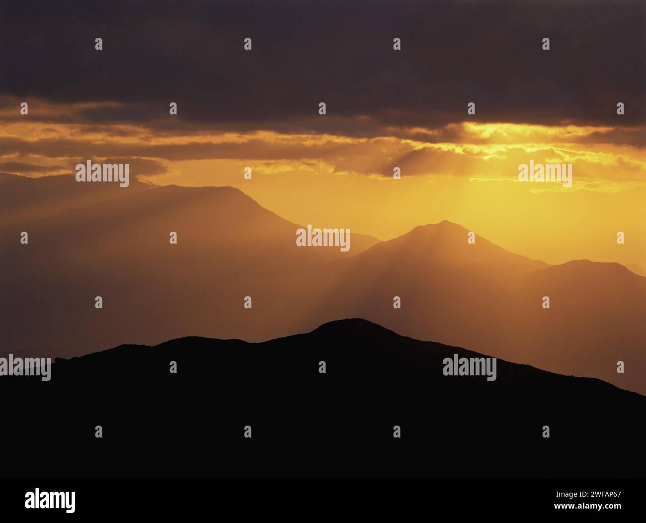 Sunrise over ridges of foothills at Ghul Bhanjyang in the Helambu ...