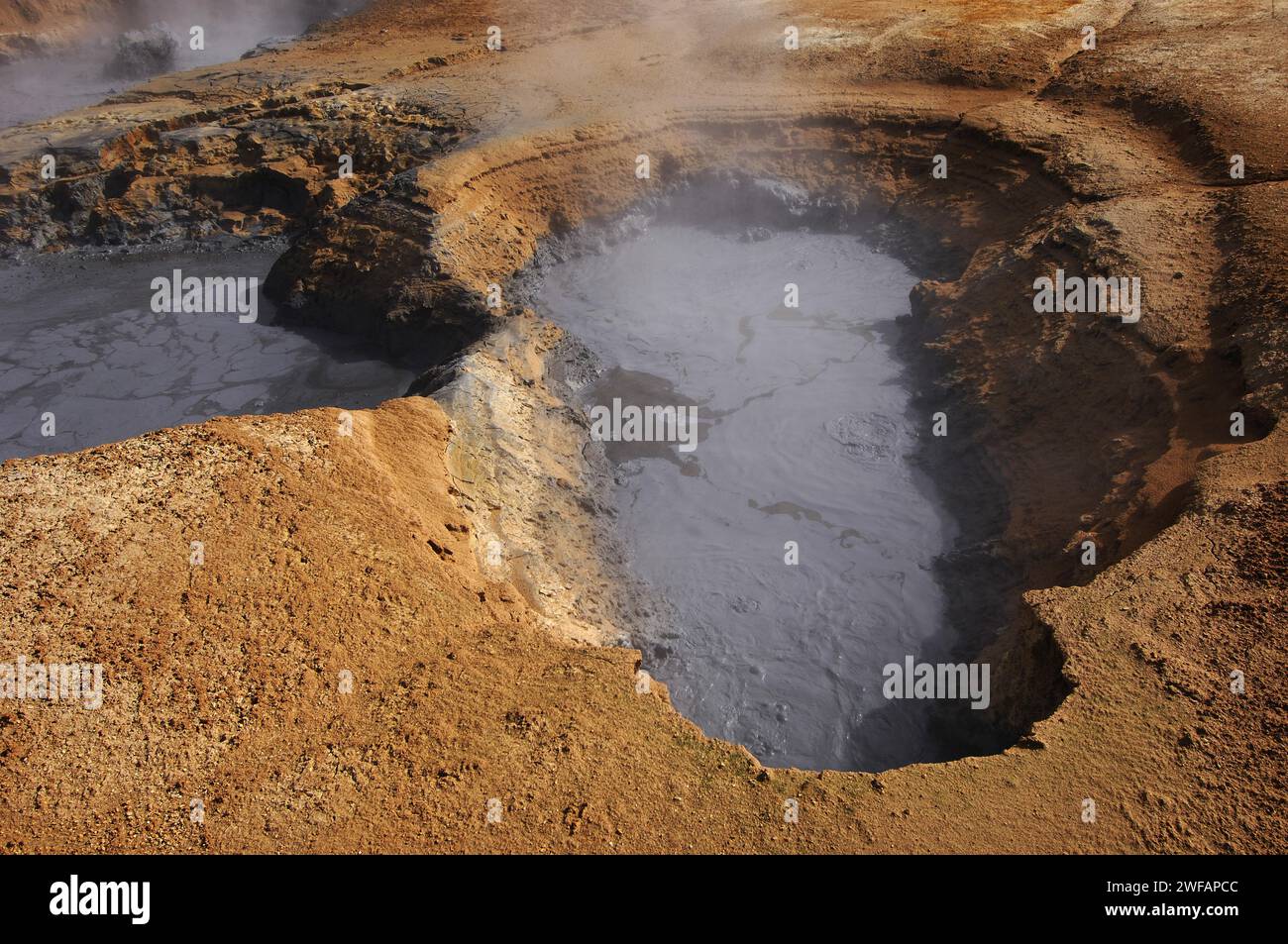 Boiling mud-pool in a geothermal landscape at Hverarond near Myvatn ...