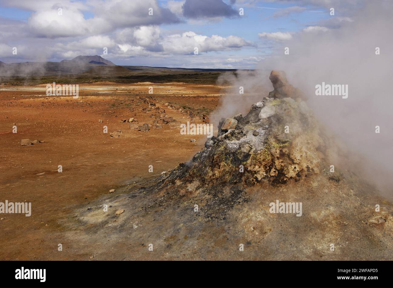 Close-up of steaming vent or fumarole in a geothermal landscape with a ...
