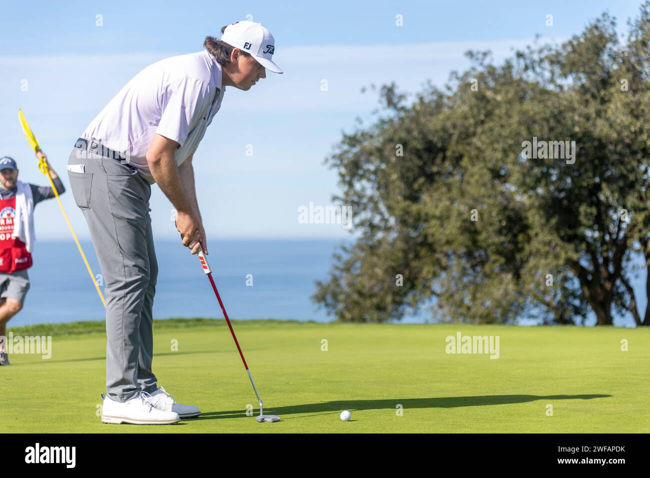 LA JOLLA, CA - JANUARY 27: Trace Crowe lines up a putt on the second ...