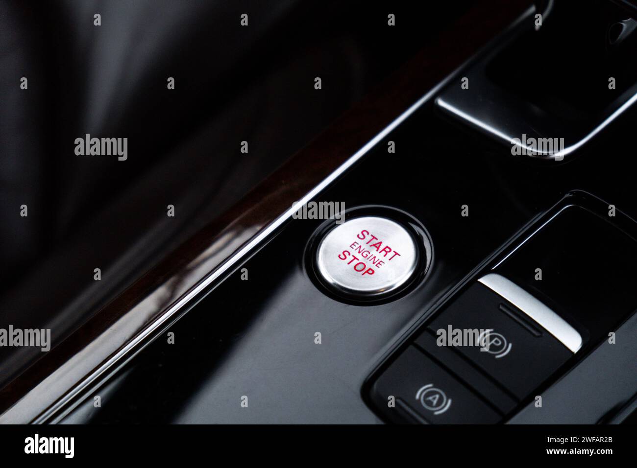 Start engine stop button Interior of modern luxury car. Details of ...