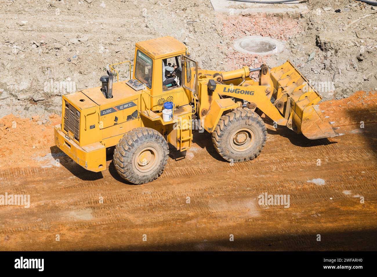 Excavator digging the land Stock Photo - Alamy