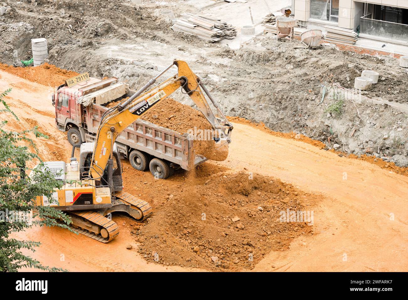 Excavator digging the land Stock Photo - Alamy