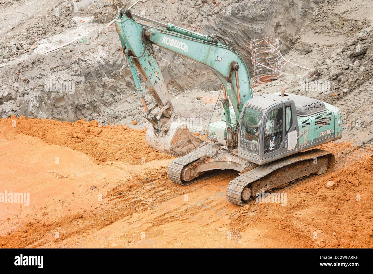 Excavator digging the land Stock Photo - Alamy