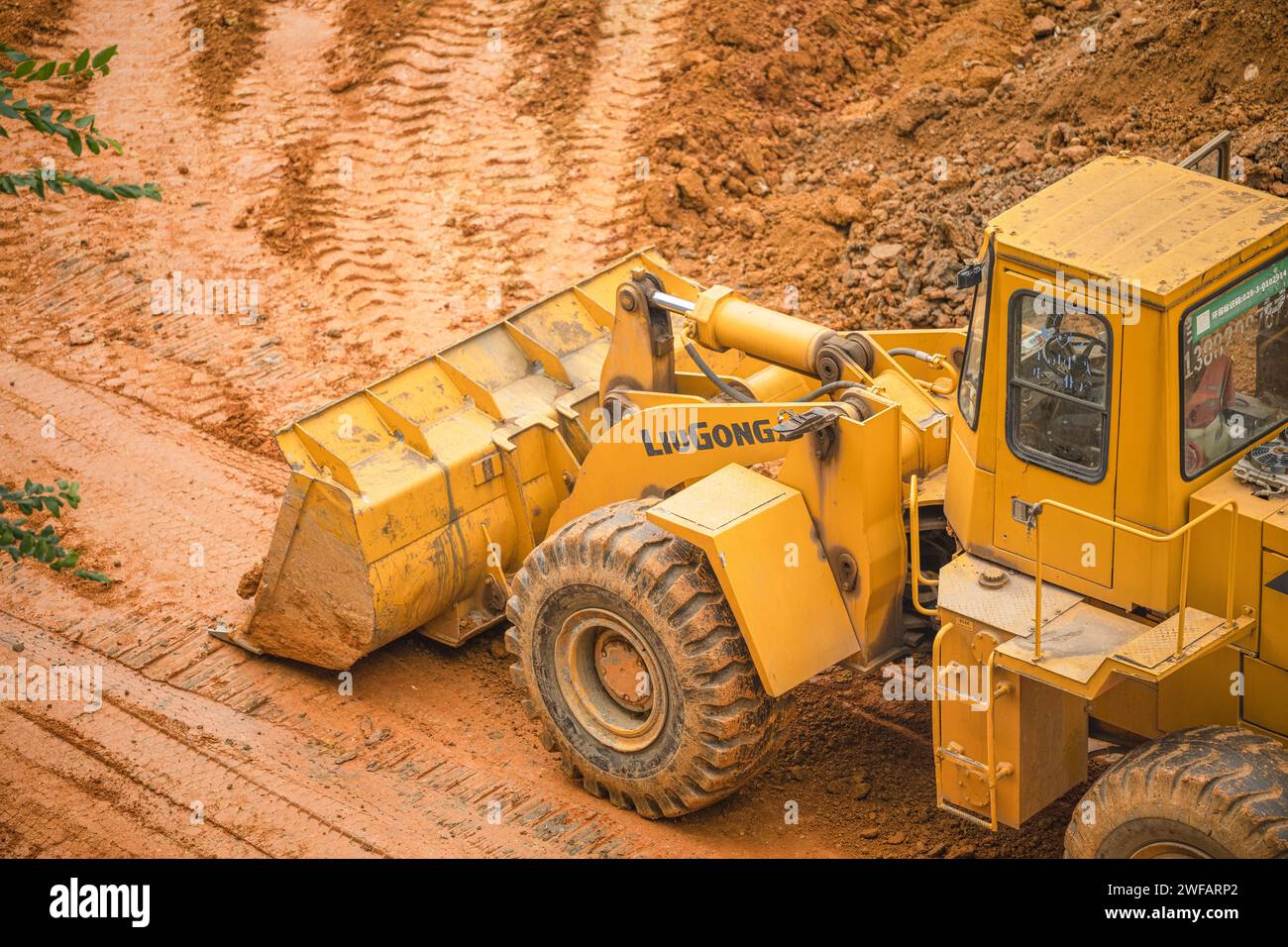 Excavator digging the land Stock Photo - Alamy