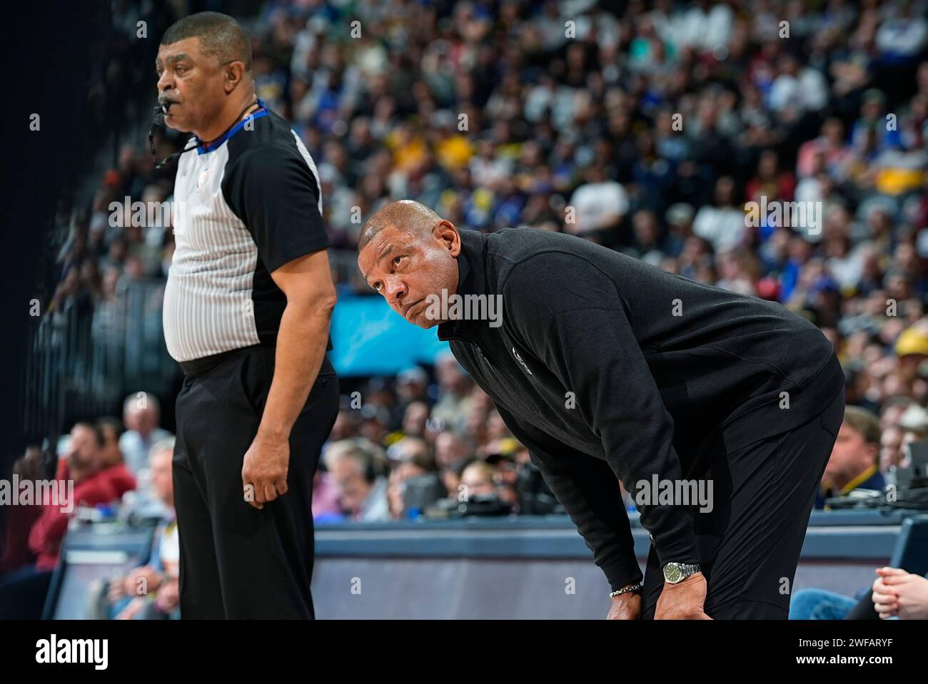Milwaukee Bucks head coach Doc Rivers, right, looks on with referee ...