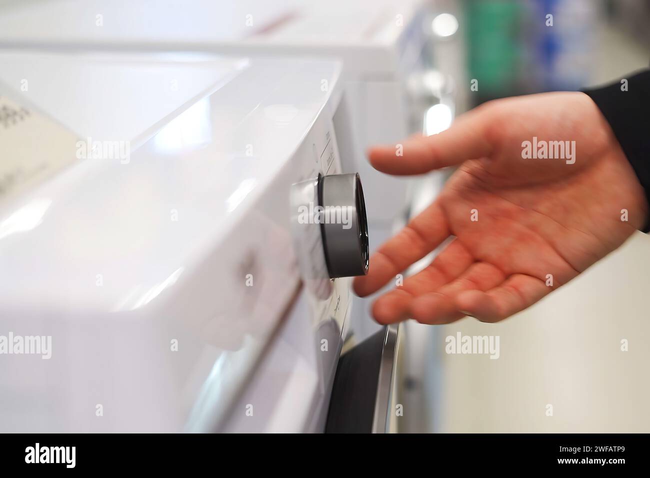 Male hand adjusts temperature hi-res stock photography and images - Alamy