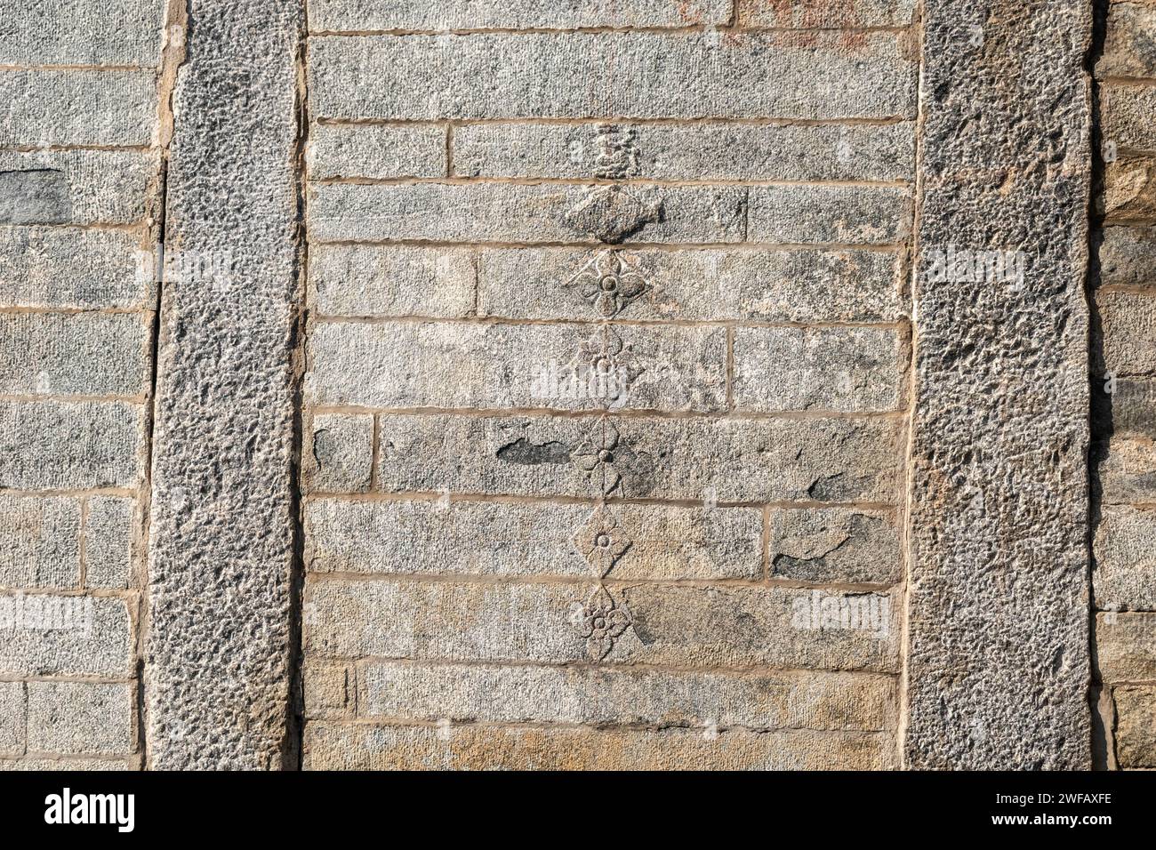 Beautiful decorative designs on the ancient stone walls of the ...
