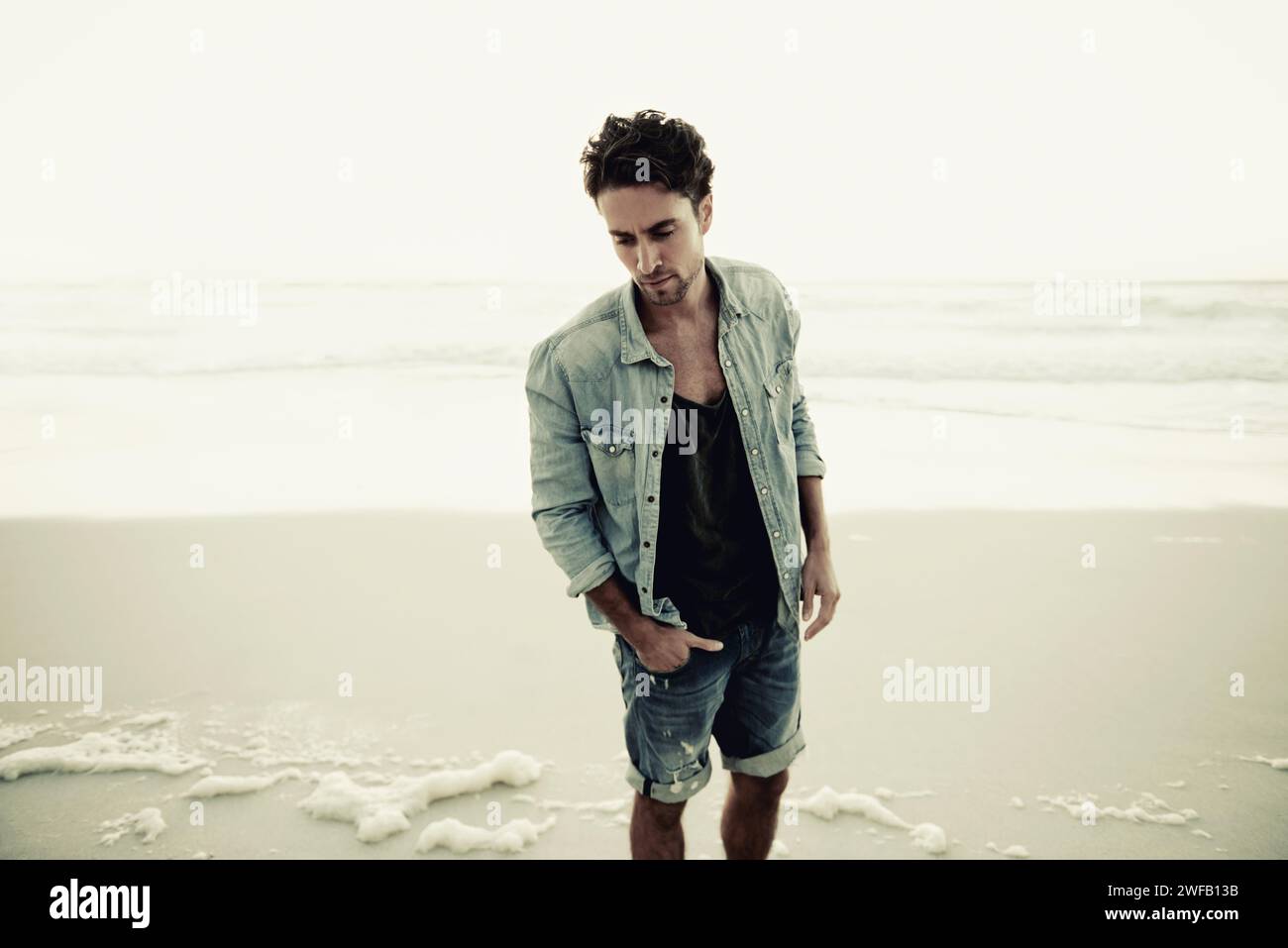 Man, beach and thinking at sunset on vacation in trendy clothes, edgy ...