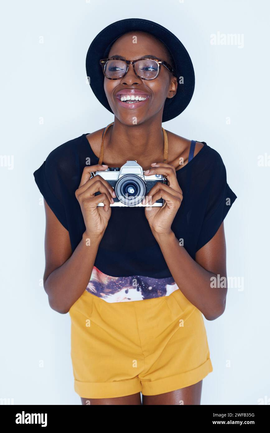 Black woman, photographer and happiness in studio with camera ...