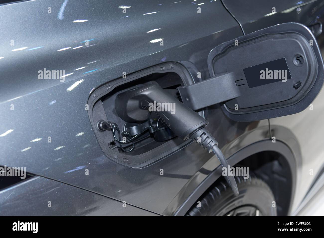 Connect the EV plug for charging the EV car Stock Photo - Alamy