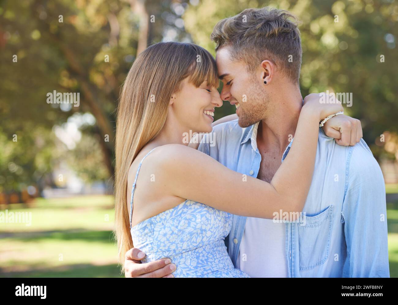 Couple, nose touch and hug in park with happiness outdoor, love and ...