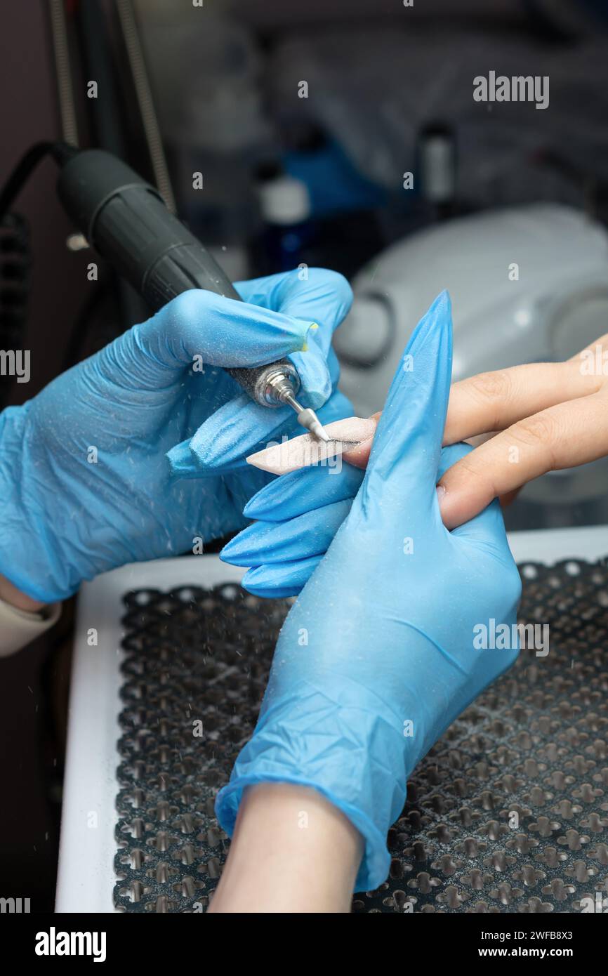 Electric filing tool used by manicurist for shaping edge nails Stock ...