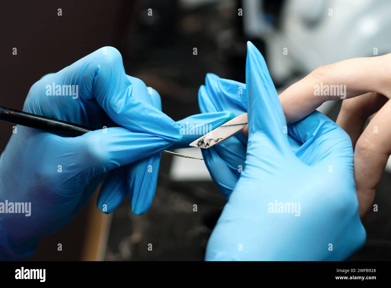Nail technician using electric file hi-res stock photography and images ...