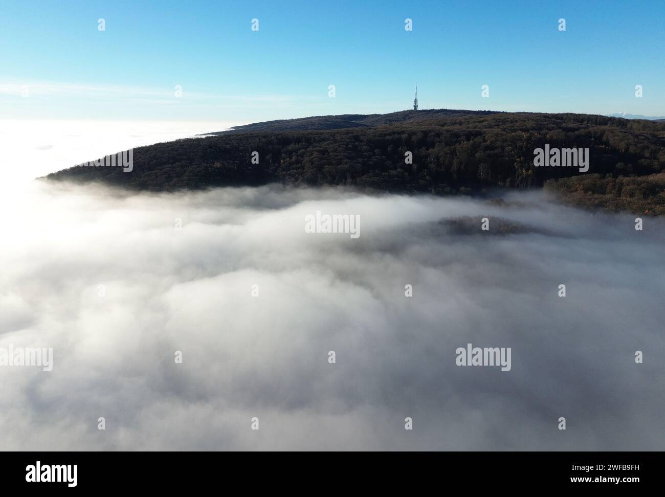 View over clouds of the radio tower Kamzik in Bratislava, Slovakia ...