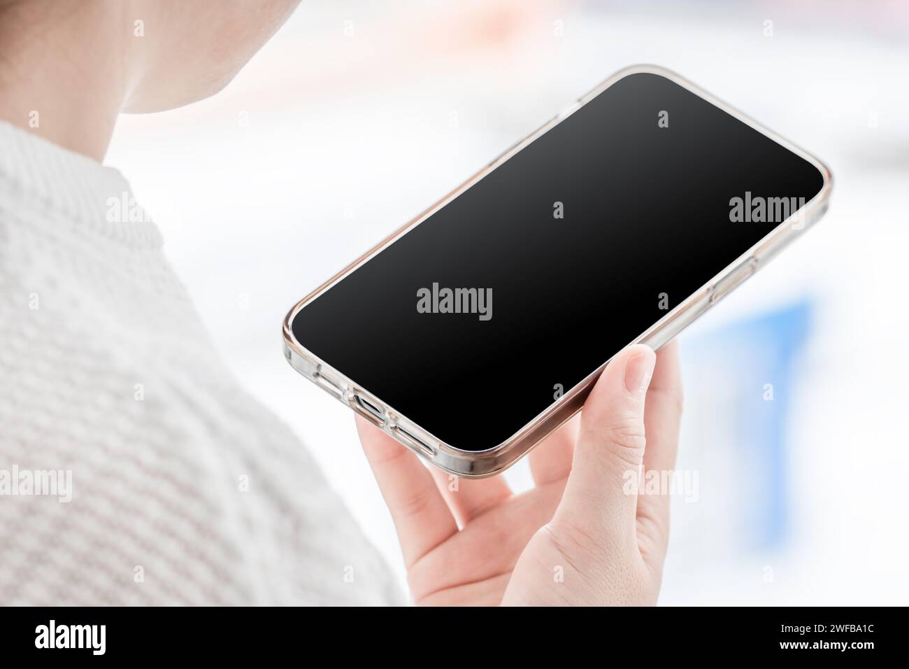 Back view of unrecognizable woman talking phone. Girl looking at her ...