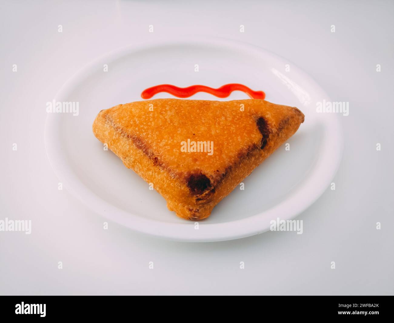 A slice of bread Pakoda with tomato sauce, an Indian tea time snack ...