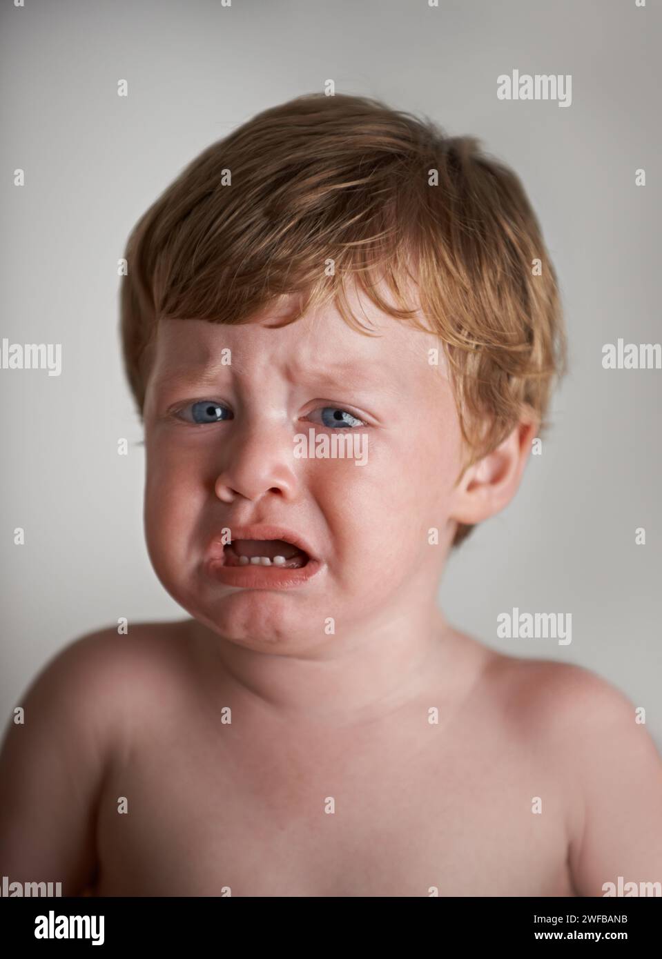 Sad toddler, crying and portrait of boy in his home with emotional ...