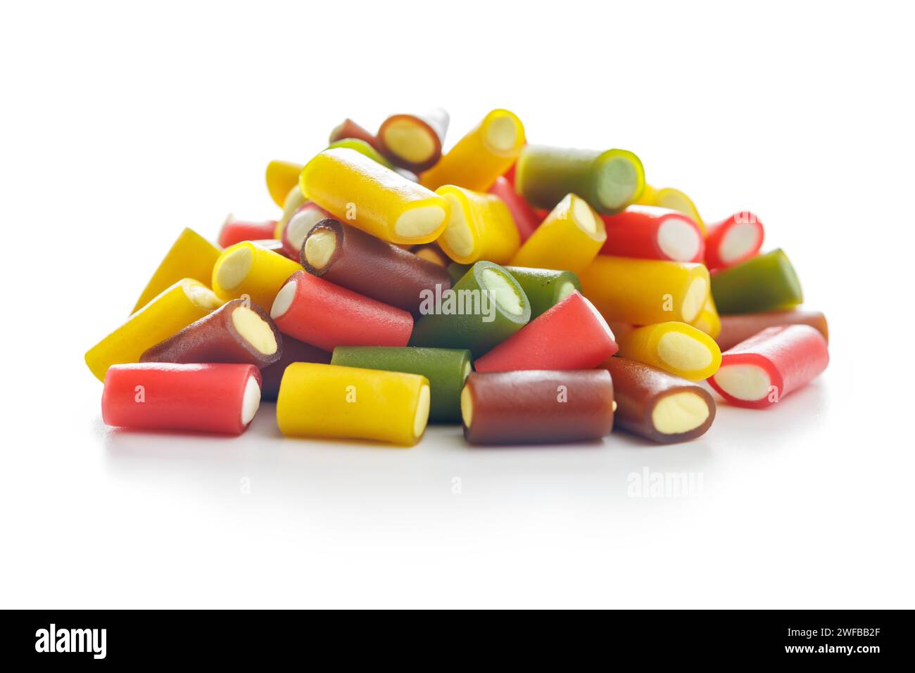 Sweet colorful chewy candy sticks isolated on the white background ...