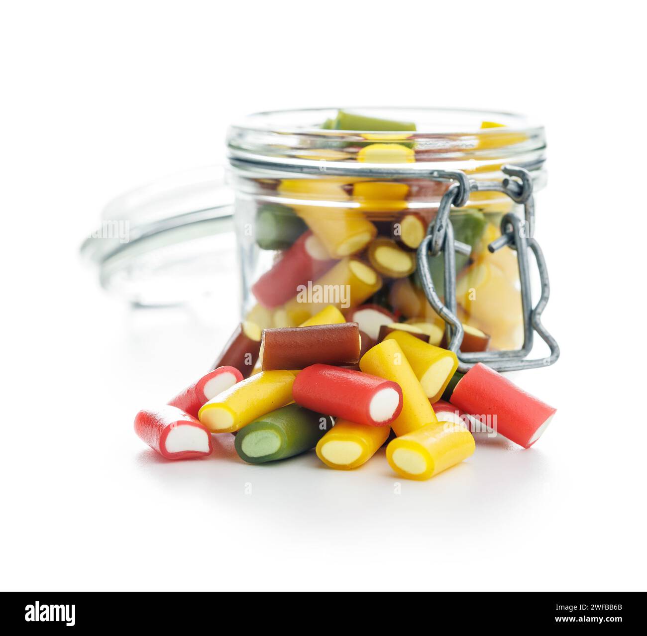 Sweet colorful chewy candy sticks in jar isolated on the white ...