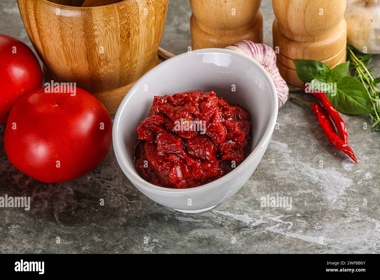 Natural organic red tomato paste in the bowl Stock Photo - Alamy