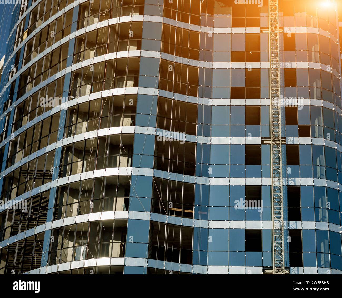 construction site of a skyscraper building on blue sky Stock Photo - Alamy