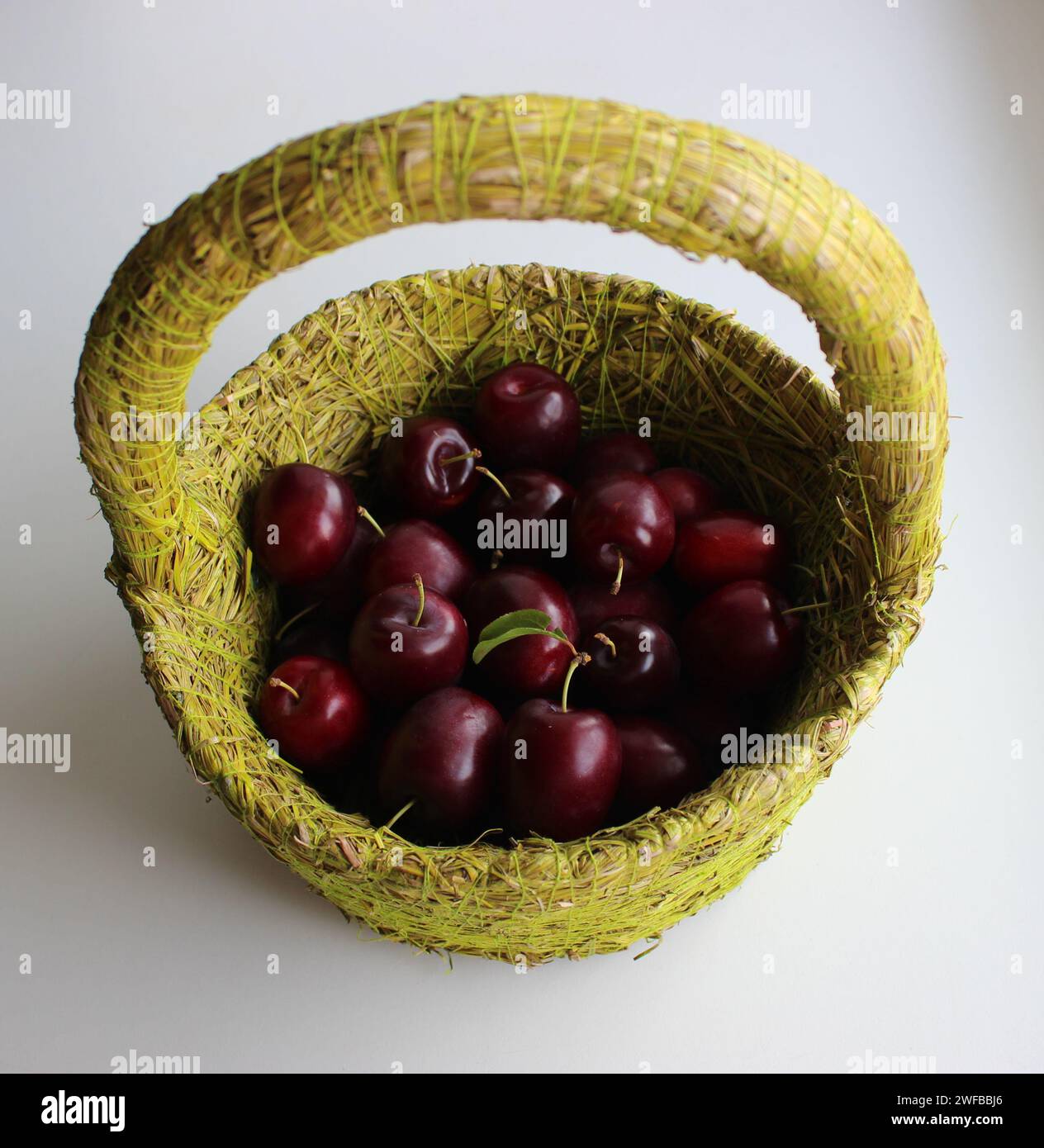 Homemade Straw Basket Filled With Fresh Plum Fruits Isolated On White ...