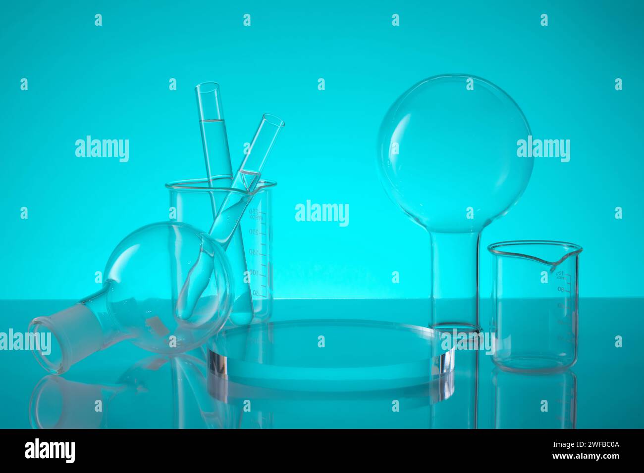Some laboratory glassware are decorated around of a transparent podium ...