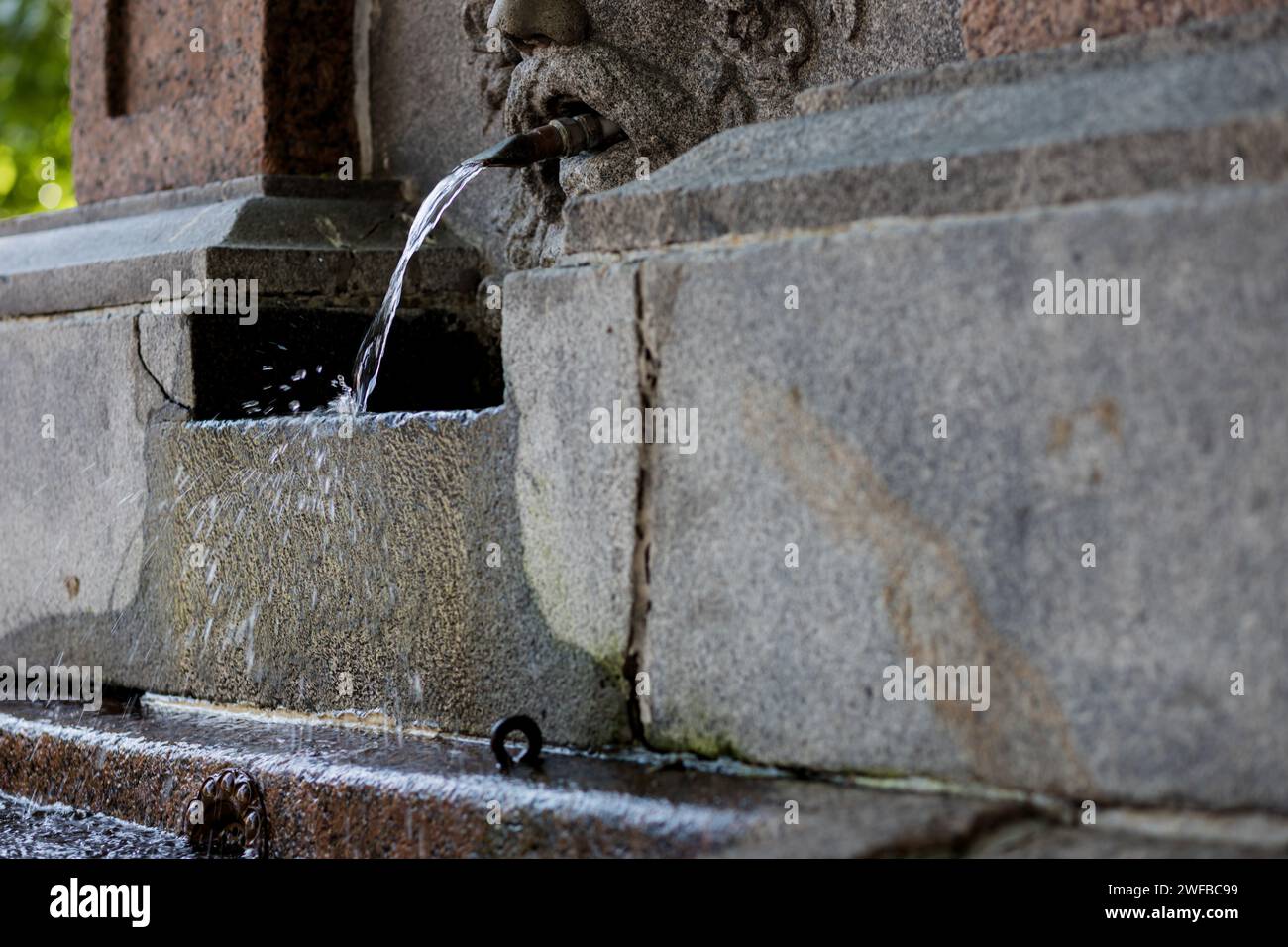 Spring of water flowing through a fountain. Crystal clear drinking ...