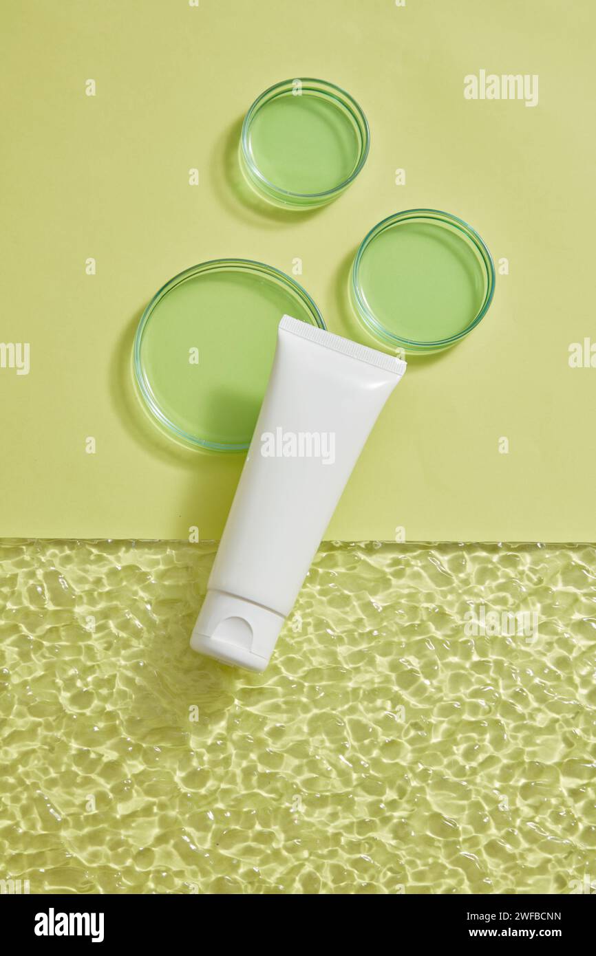 A white tube without label displayed with petri dishes in different ...