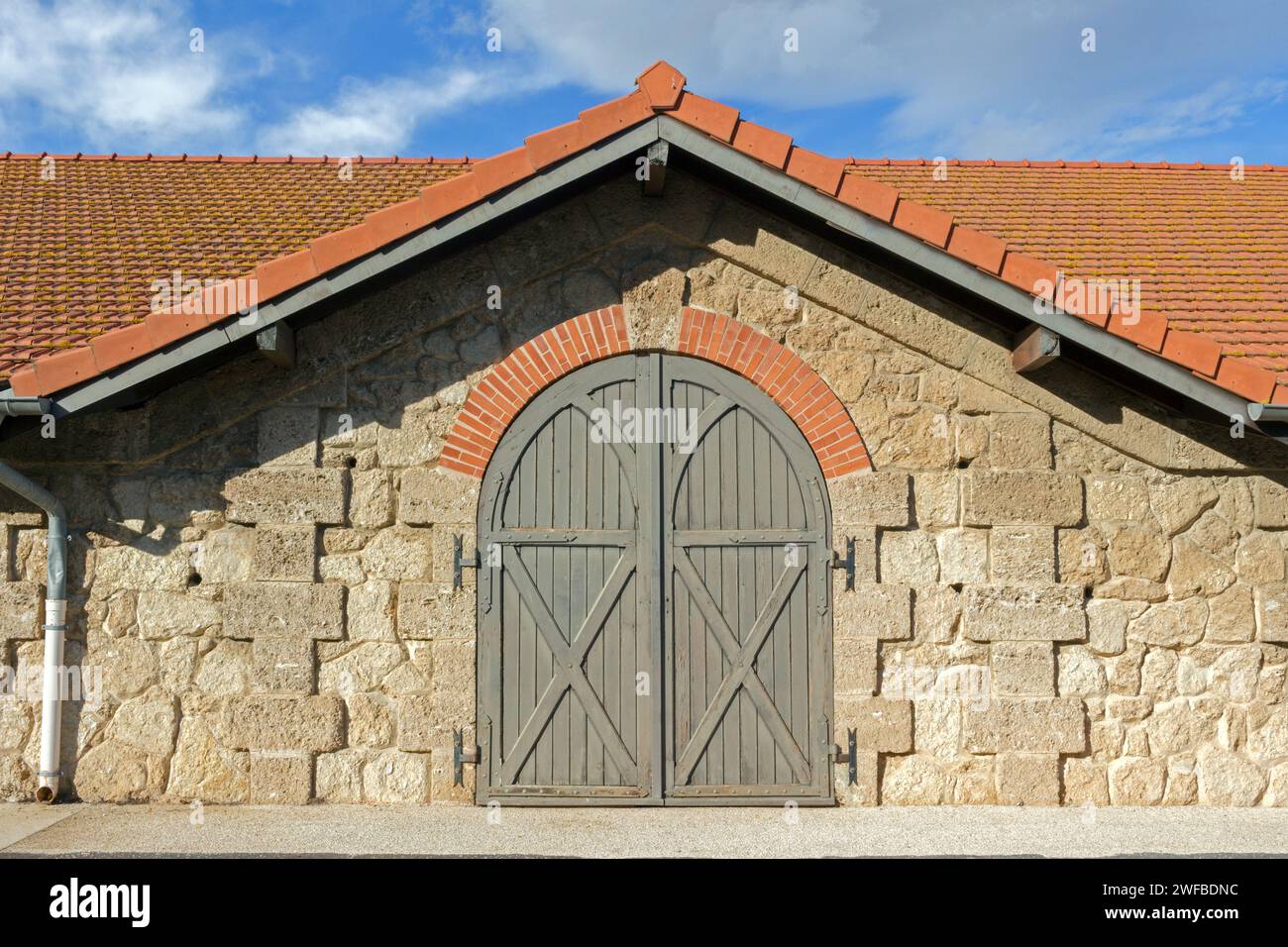 Exterior of the old cellar of the "Chateau de Colombiers" on a bank of ...