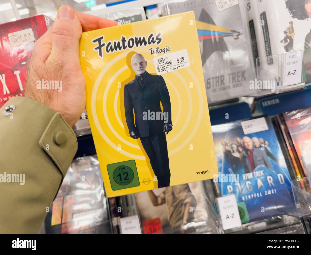 Berlin, Germany - Jan 25, 2024: POV of a male hand holding a Fantomas ...