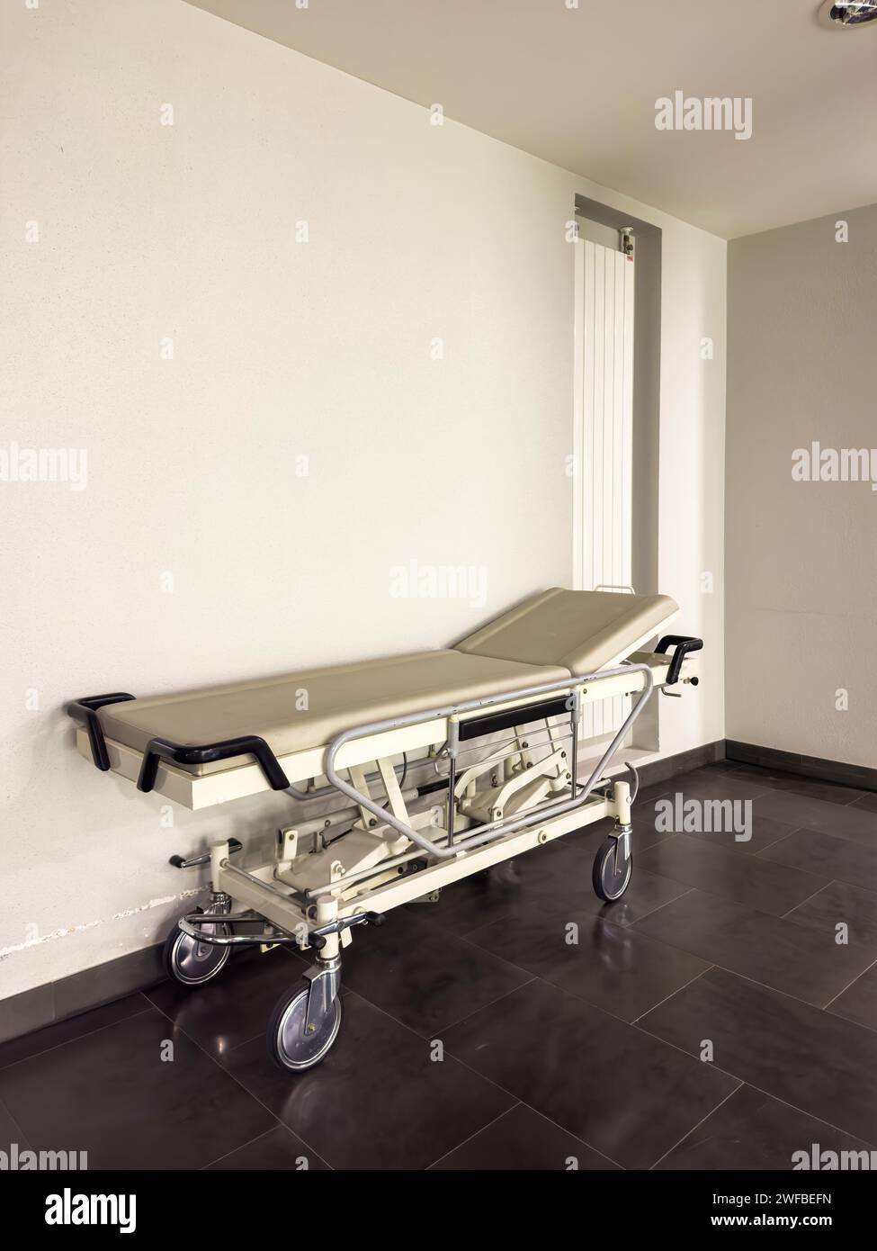 Vertical image of an empty hospital transport bed on the clinic ...