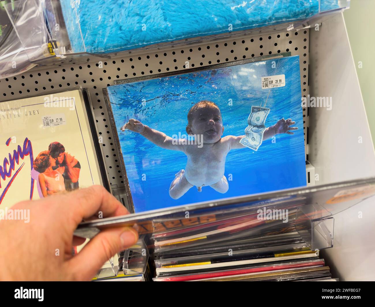 Berlin, Germany - Jan 18, 2024: A POV shot of a male hand reaching out to purchase the iconic ...