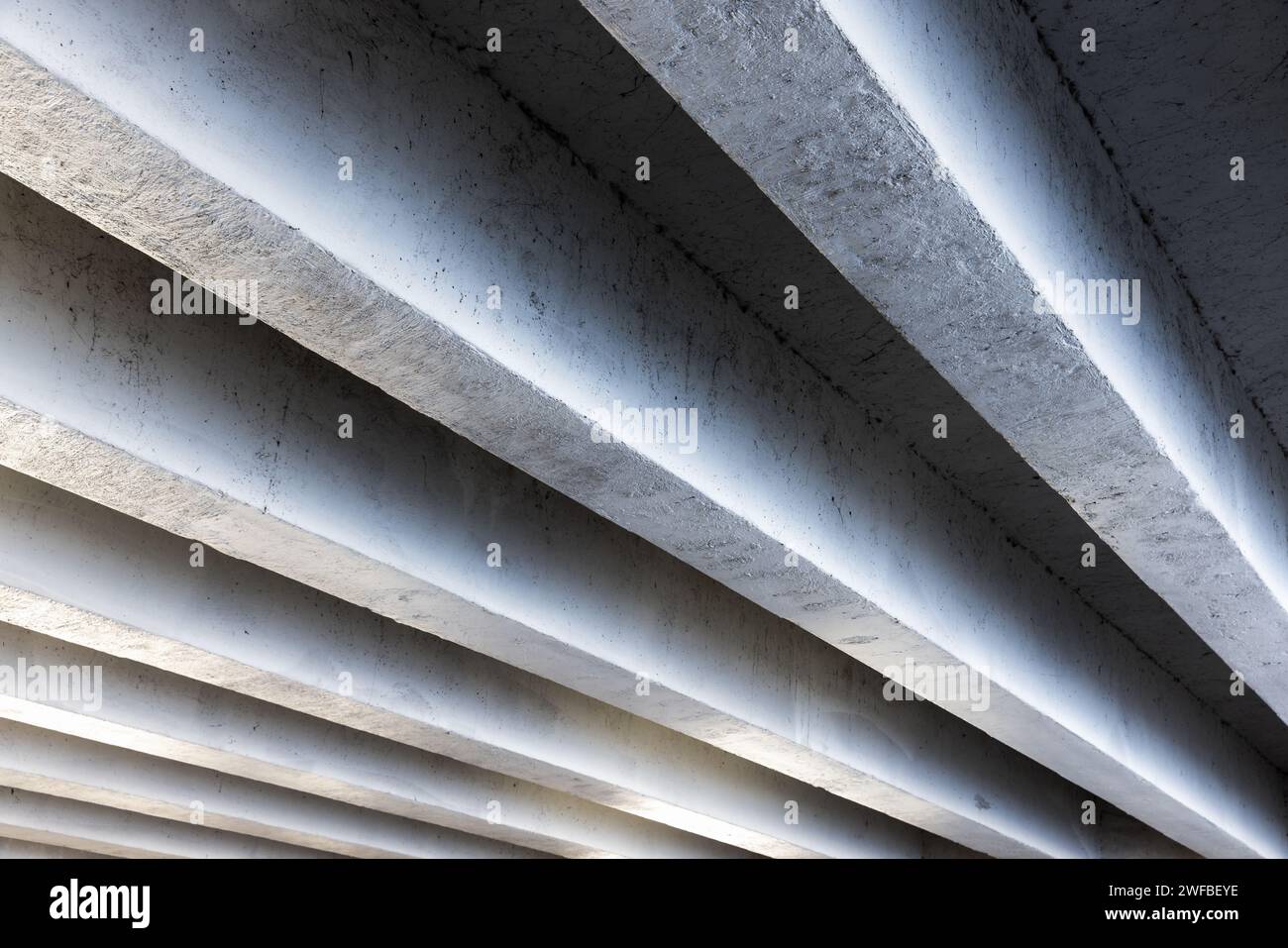 Bottom concrete details of an overhead bridge span. Abstract industrial ...