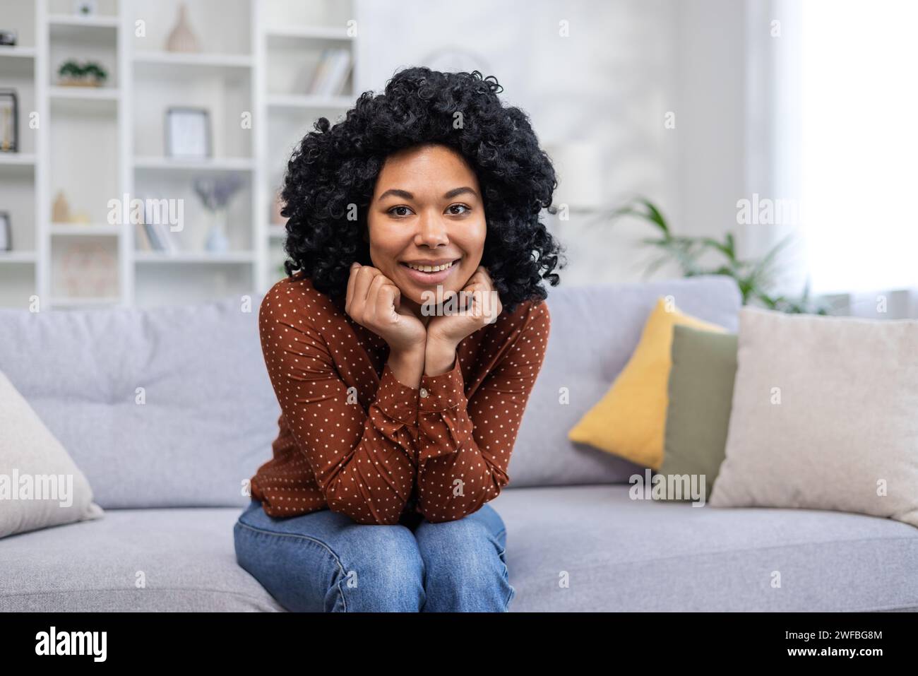 Woman leaning on couch hi-res stock photography and images - Alamy