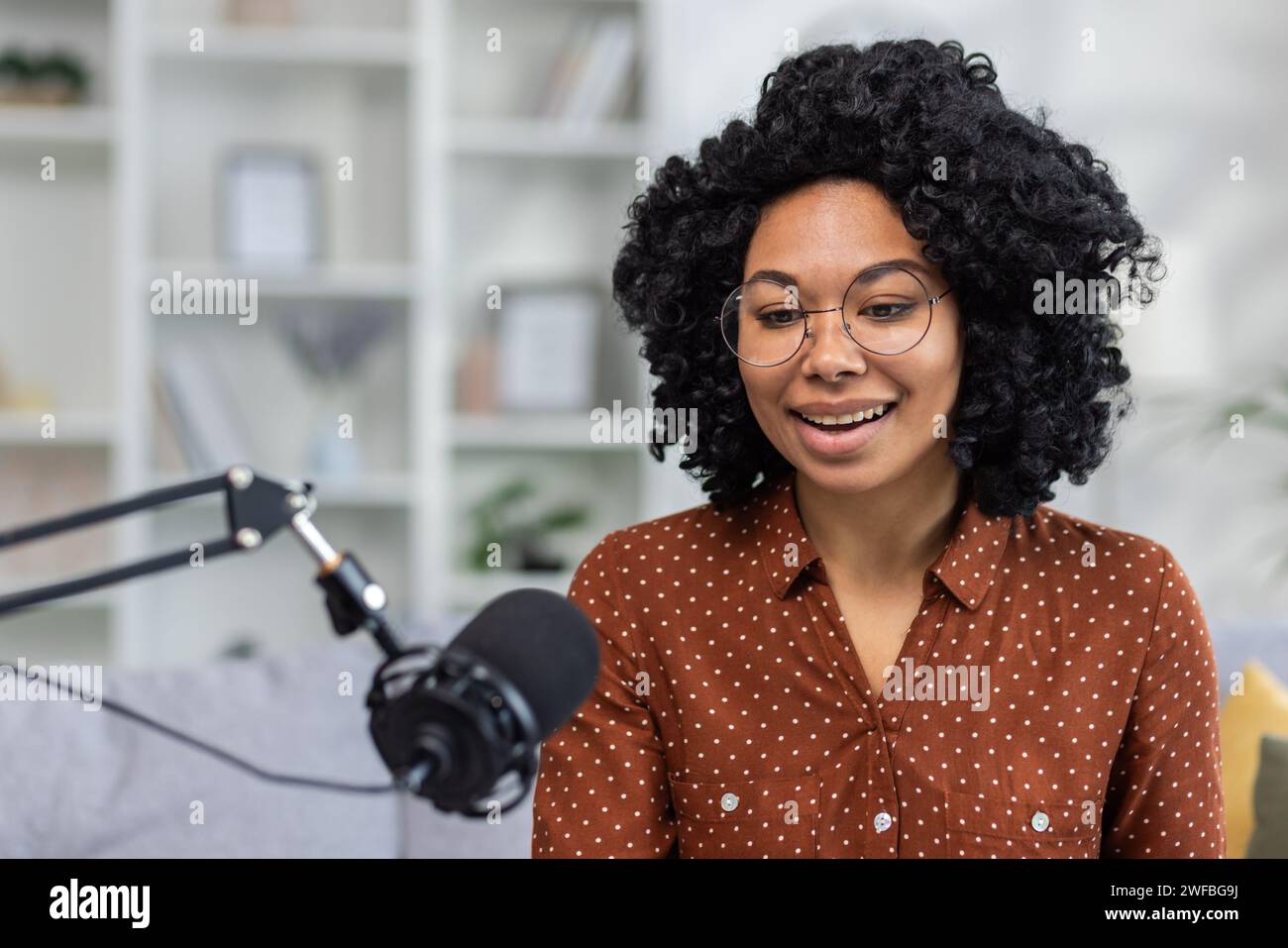Hispanic woman podcasting indoor microphone hi-res stock photography ...