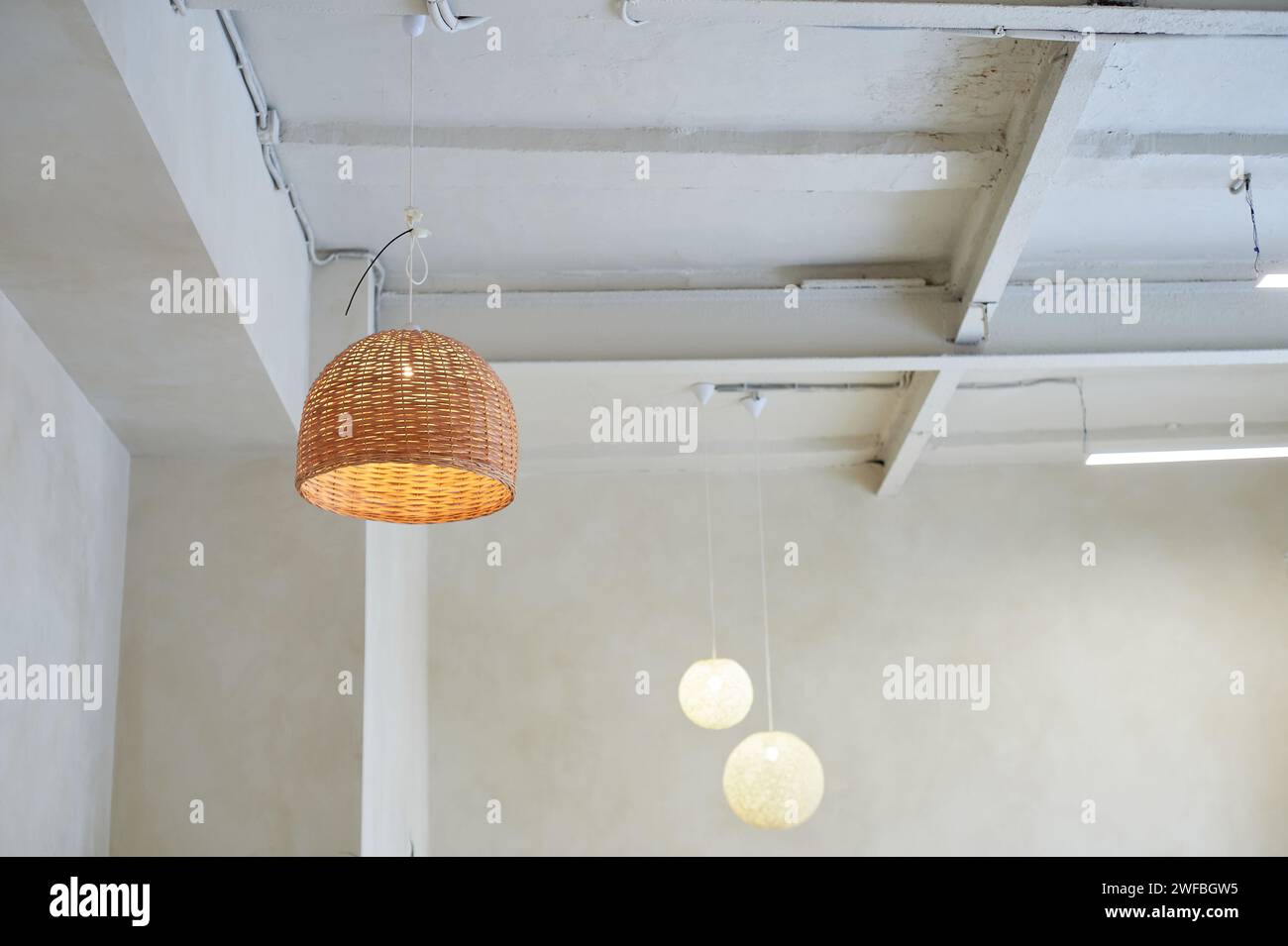 Large thatched ceiling lamp. Loft style. High ceilings with rails ...