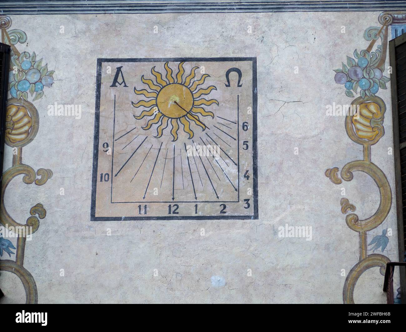 Sundial on the wall of an old brick house Sundial on a yellow wall Old ...