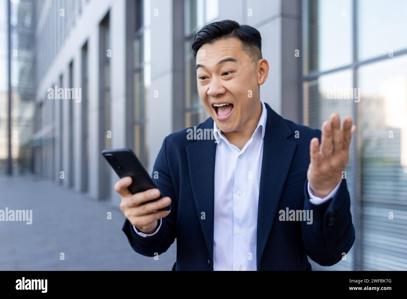 Surprised chinese man looking screen hi-res stock photography and ...