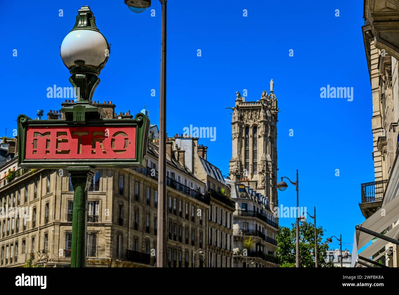 Paris, France, June 2022. Nice shot highlighting the red metro sign ...