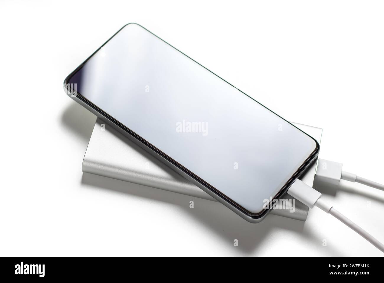 Smartphone charger with powerbank on white background Stock Photo - Alamy